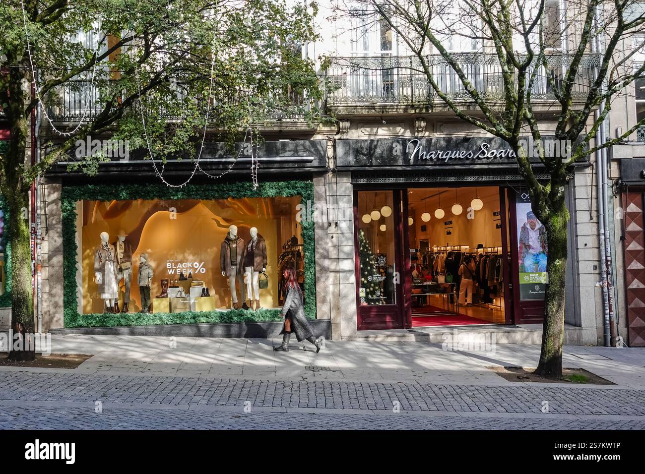 The front of a clothing store on an outdoor shopping street in Porto ...