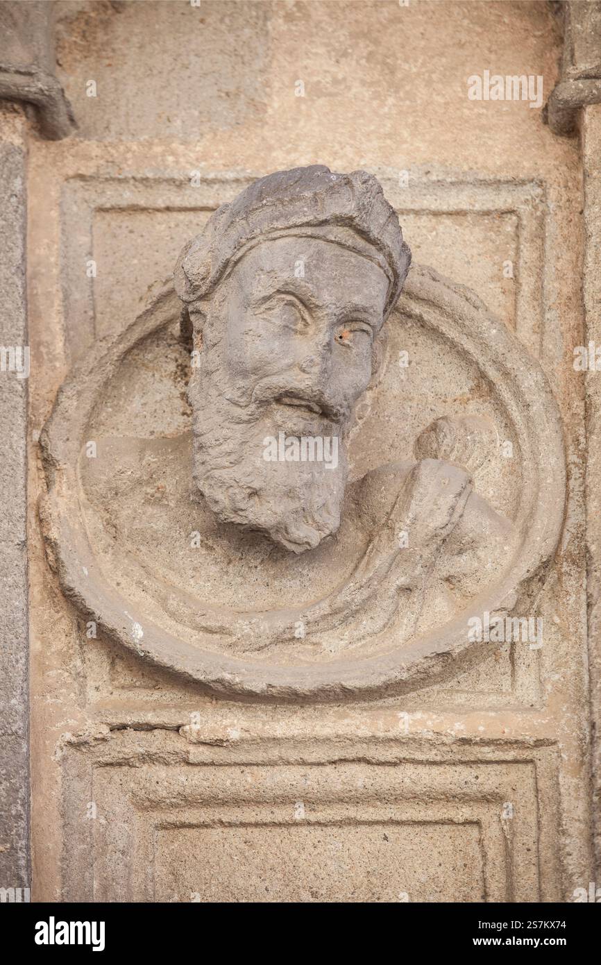 Male weathered high relief bust. Facade of Carvajal House-Palace ...