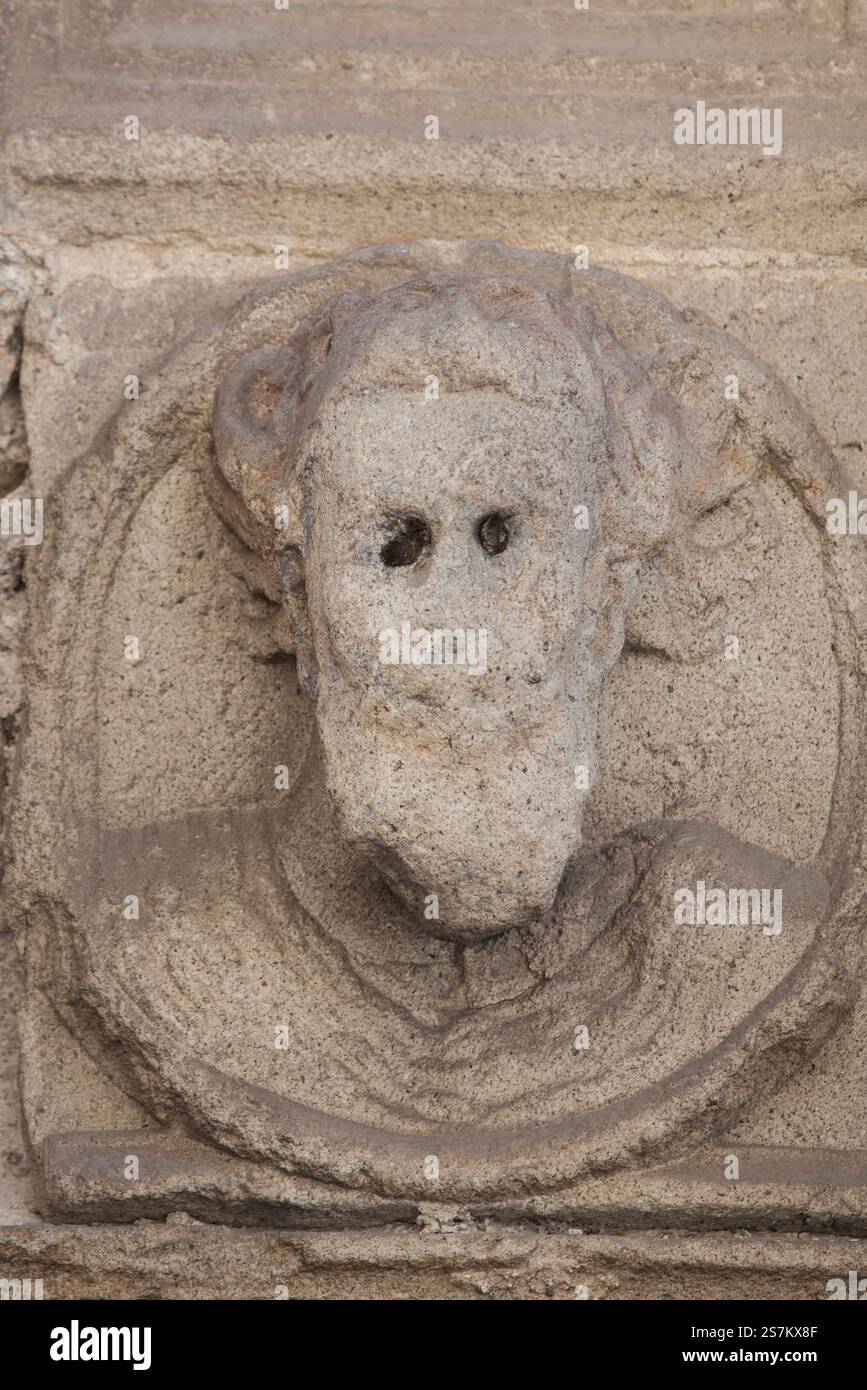 Male weathered high relief bust. Facade of Carvajal House-Palace ...
