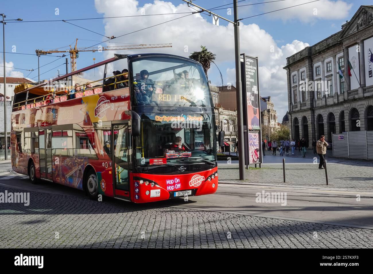 A double decker red sightseeing bus operates in Porto Stock Photo - Alamy