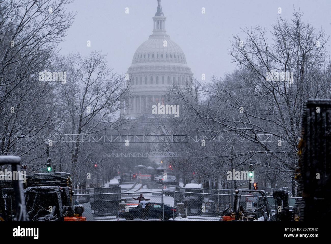 Snow falls on the Capitol in Washington, Sunday, Jan. 19, 2025. (AP ...