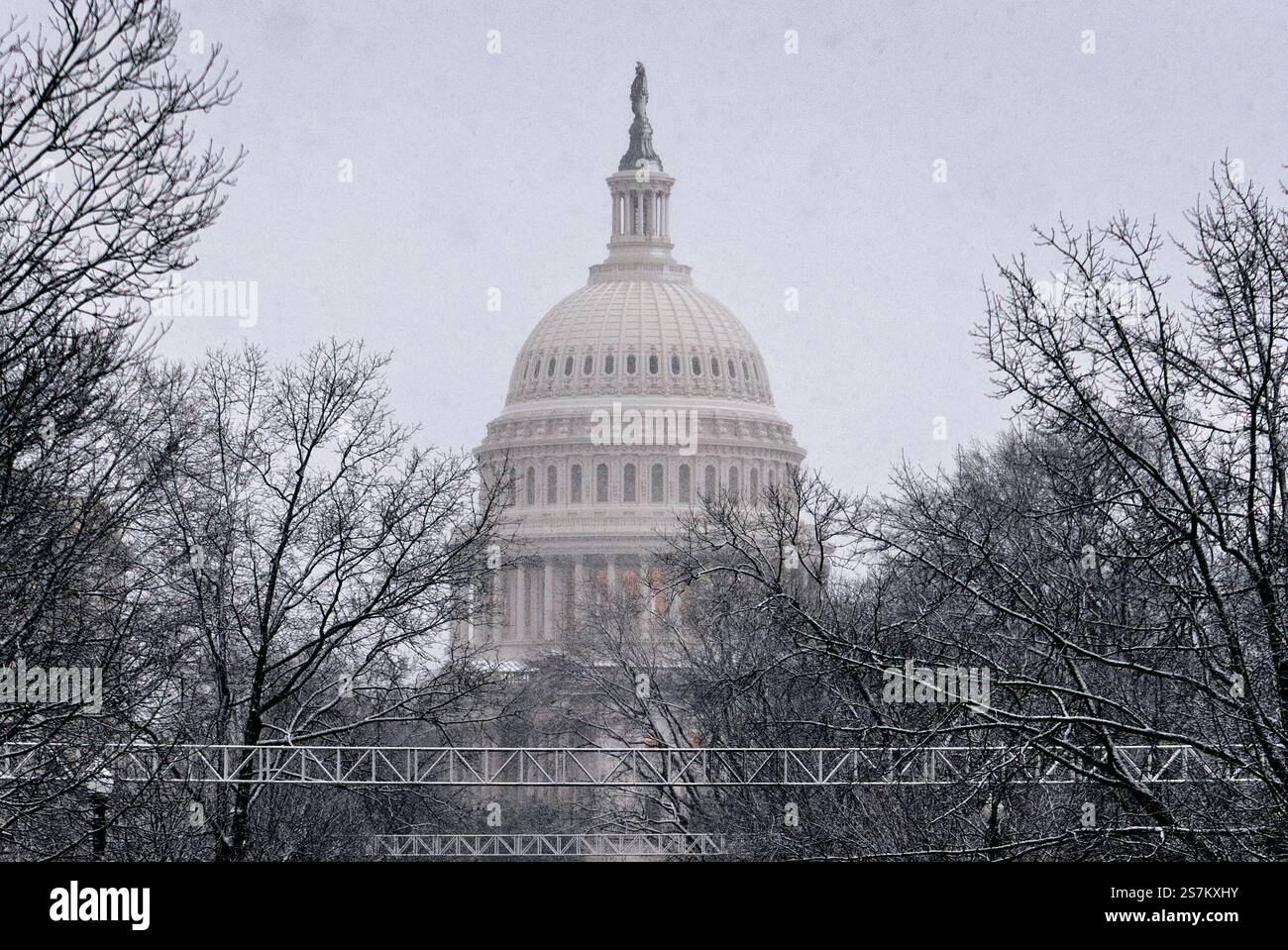 Snow falls on the Capitol in Washington, Sunday, Jan. 19, 2025. (AP ...