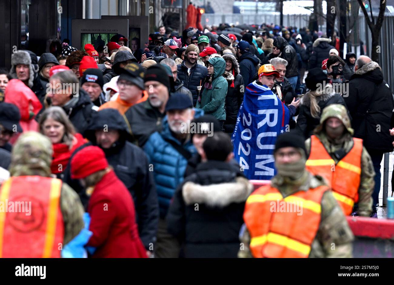 Supporters of U.S. President-elect Donald Trump head to a rally prior ...