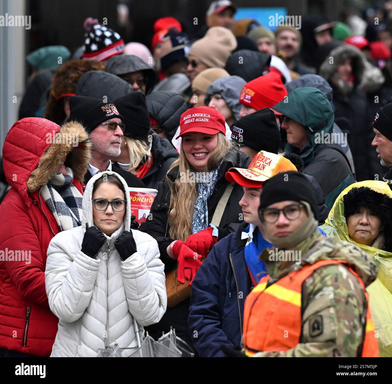 Supporters of U.S. President-elect Donald Trump head to a rally prior ...