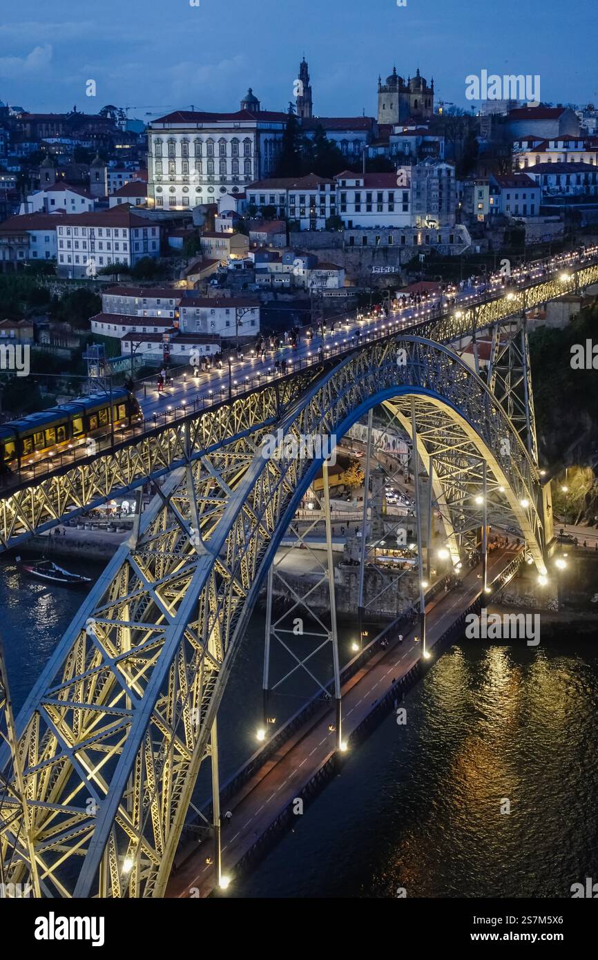 The Luís I Bridge in Porto is beautifully illuminated at night, viewed ...