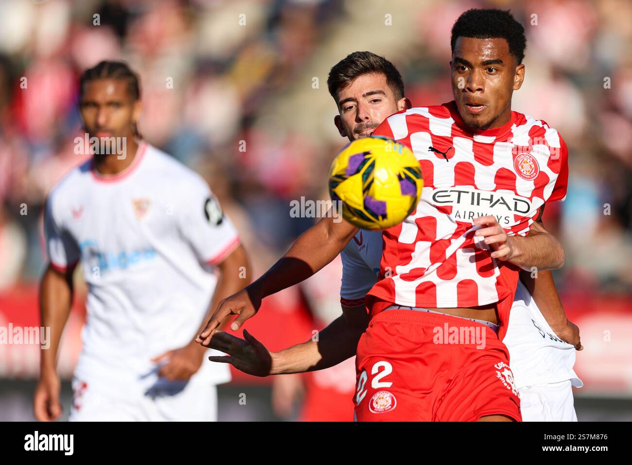 Jhon Elmer Solis of Girona FC and Enrique Salas Kika of Sevilla FC during the La Liga EA Sports ...