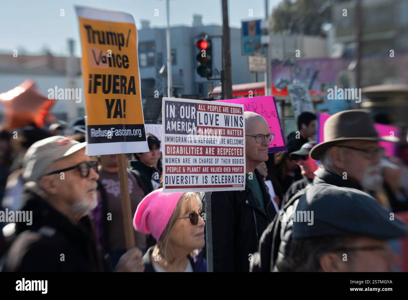 Selective focus photo of woman carrying an American flag sign next to ...