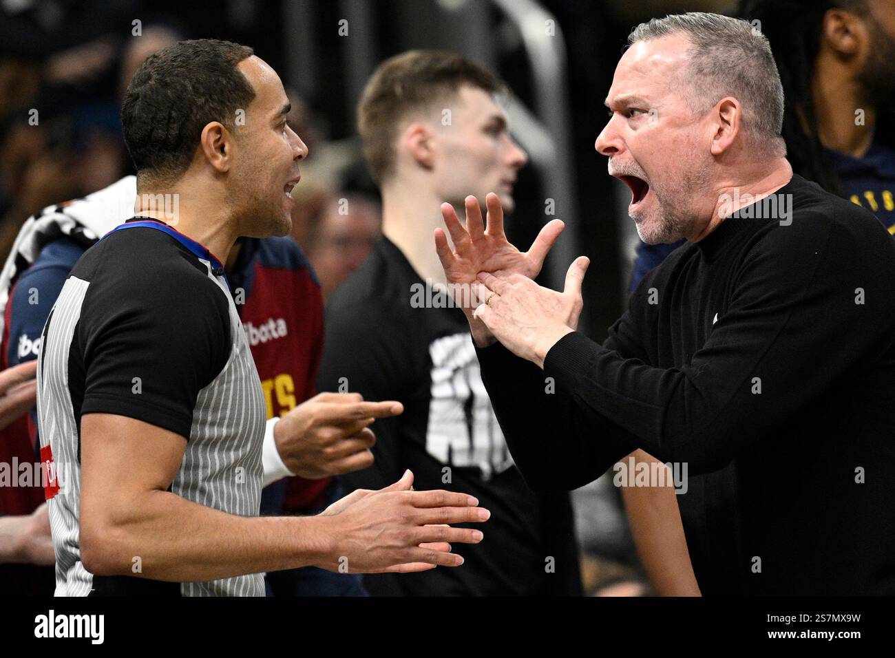 Denver Nuggets head coach Michael Malone, right, argues for a timeout ...