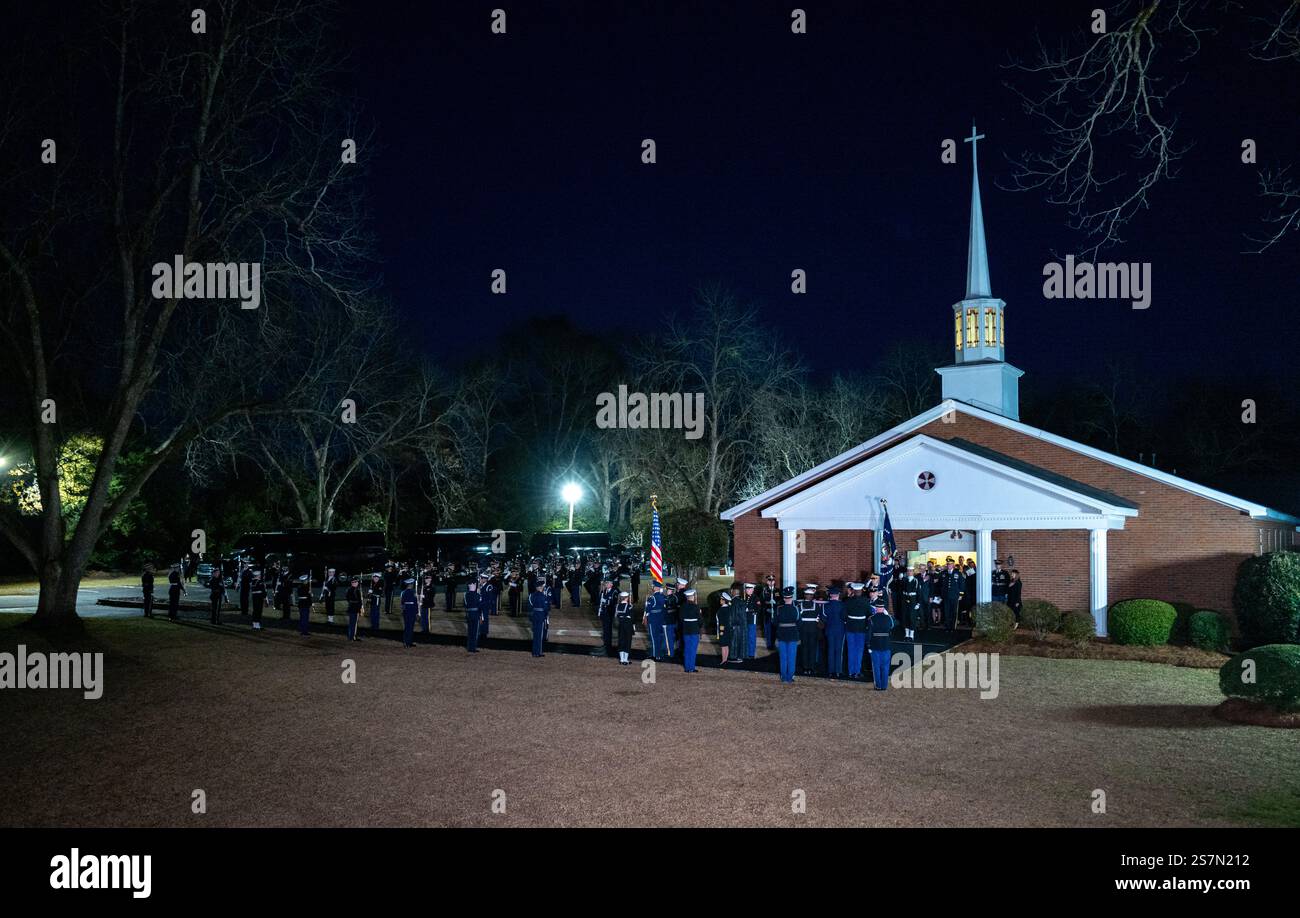 Night photo as President Jimmy Carter's flag-draped casket is brought ...