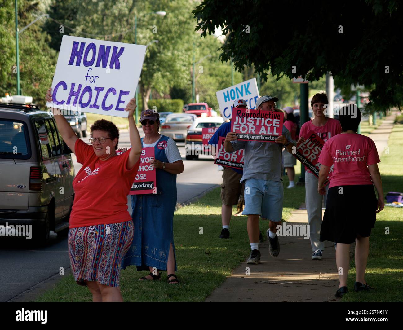 Pro-Abortion rights advocates hold signs encouraging motorists to honk ...