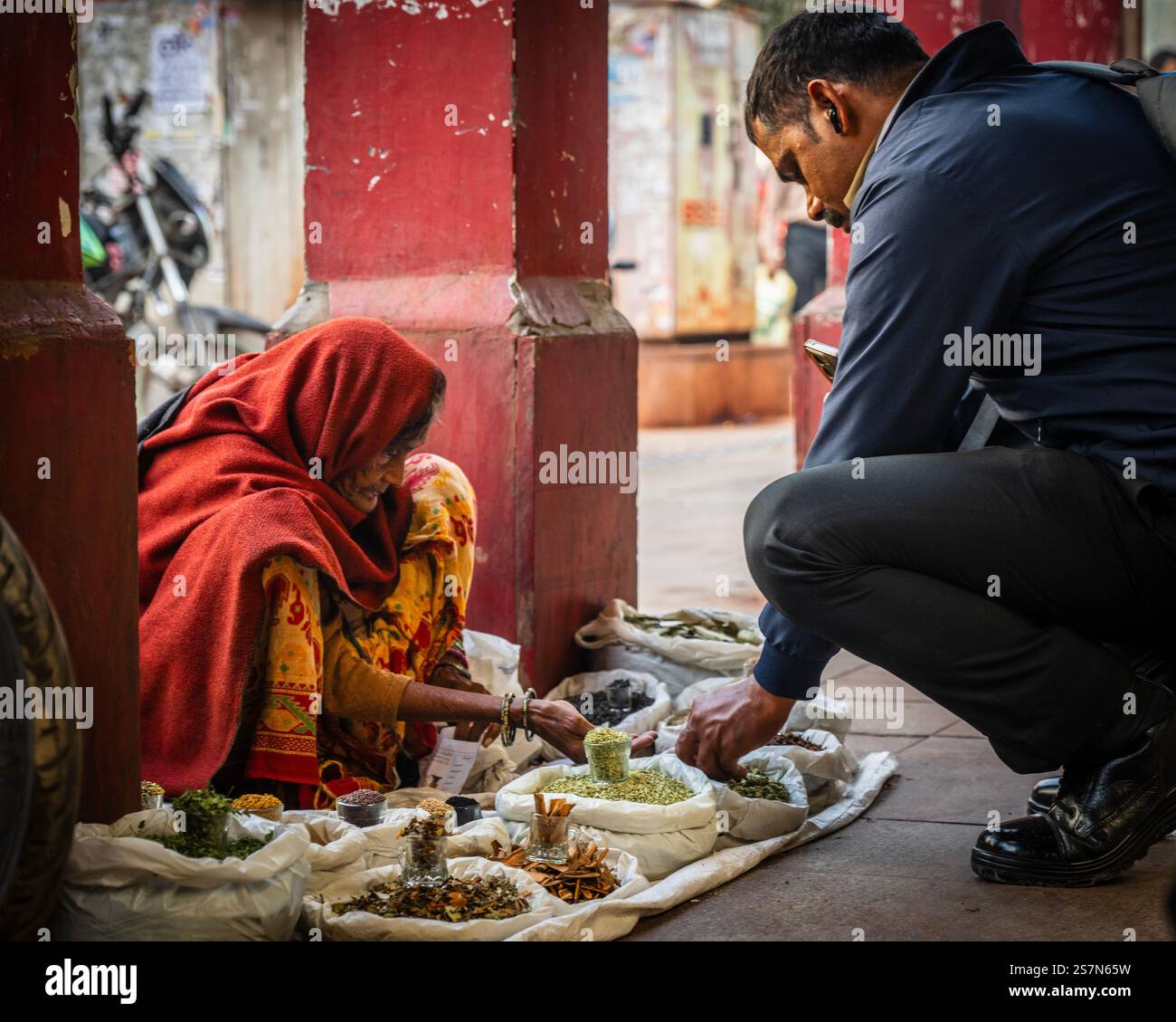 Older lady selling spices on the street of Delhi Stock Photo - Alamy