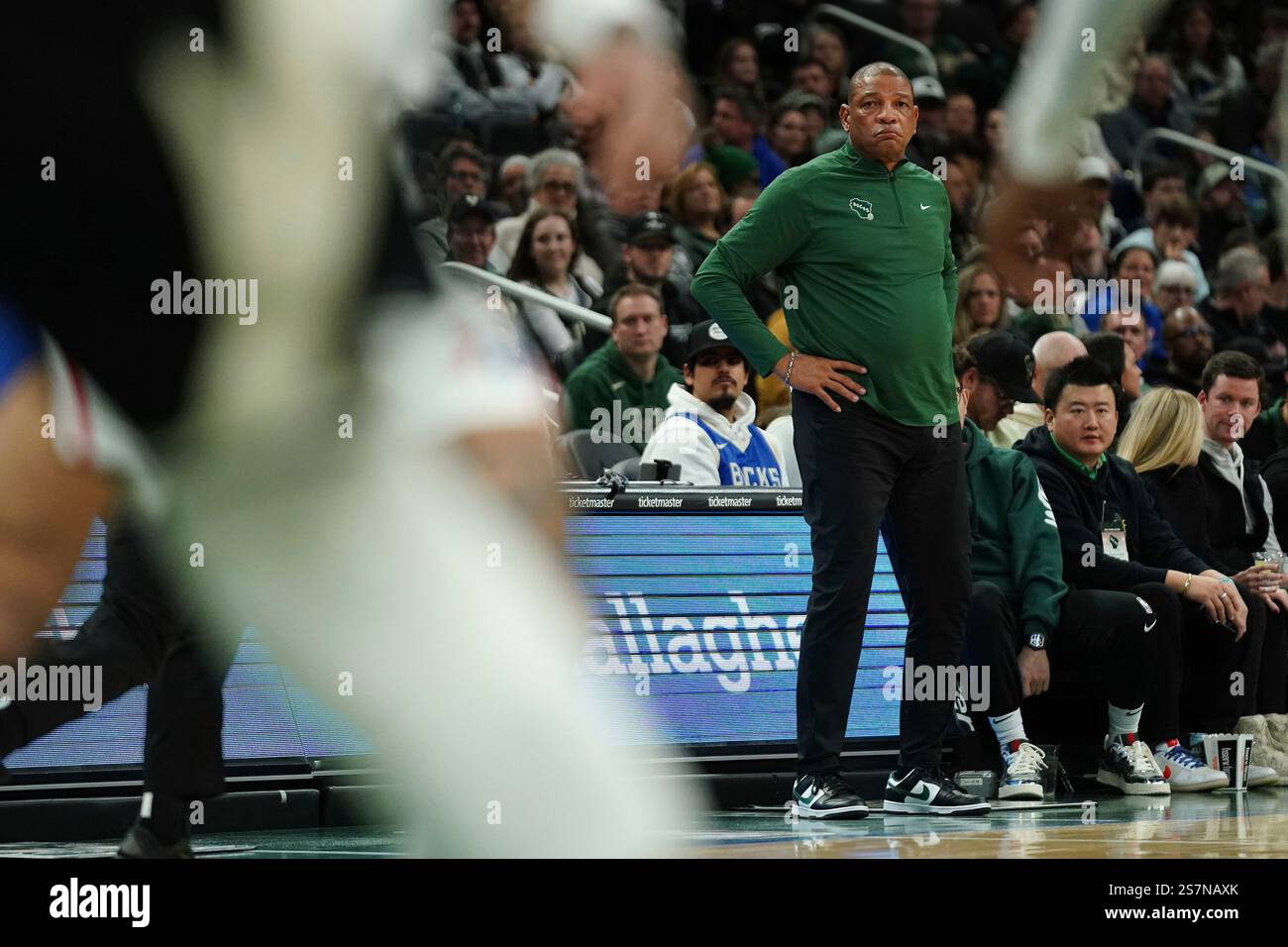 Milwaukee Bucks head coach Doc Rivers, center right, watches from the ...