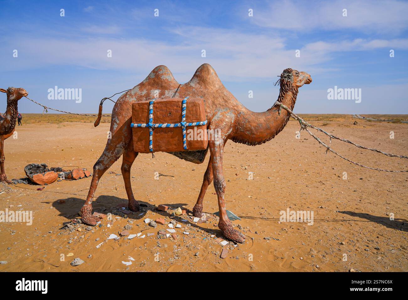 Sculpture of a camel train caravan along the ancient silk road at the gateway to the Khorezm ...