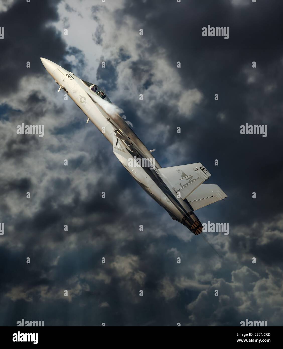 American Fighter Jet Flying Through Dramatic Clouds Stock Photo - Alamy