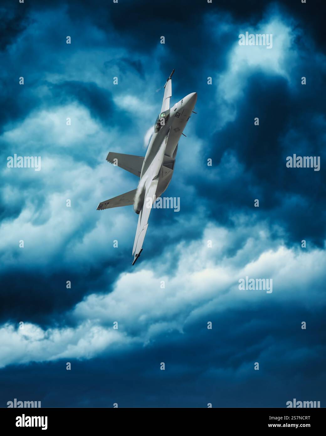 American Fighter Jet Flying Through Dramatic Clouds Stock Photo - Alamy