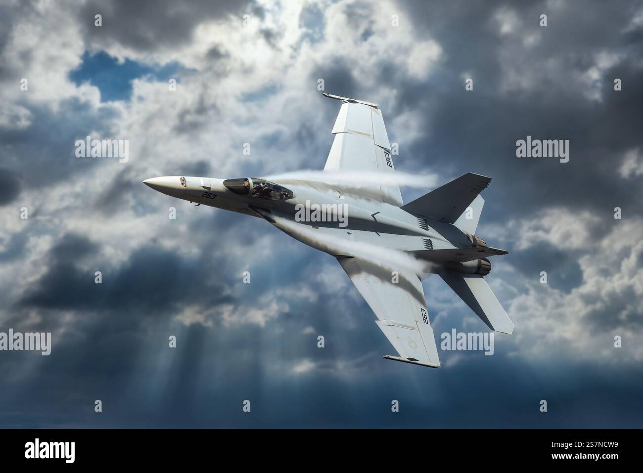 American Fighter Jet Flying Through Dramatic Clouds Stock Photo - Alamy