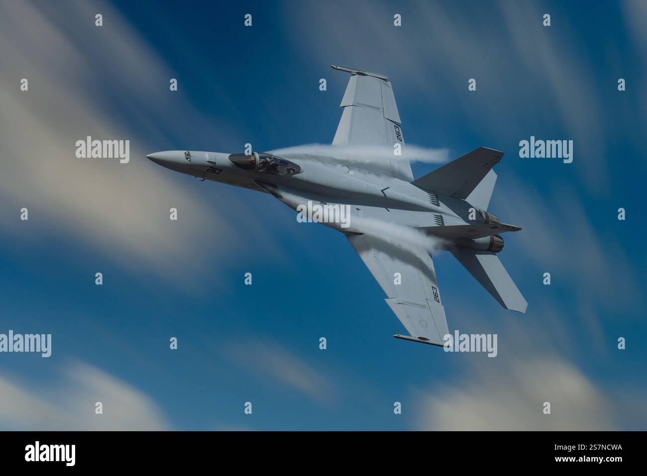 American Fighter Jet Flying Through Dramatic Clouds Stock Photo - Alamy