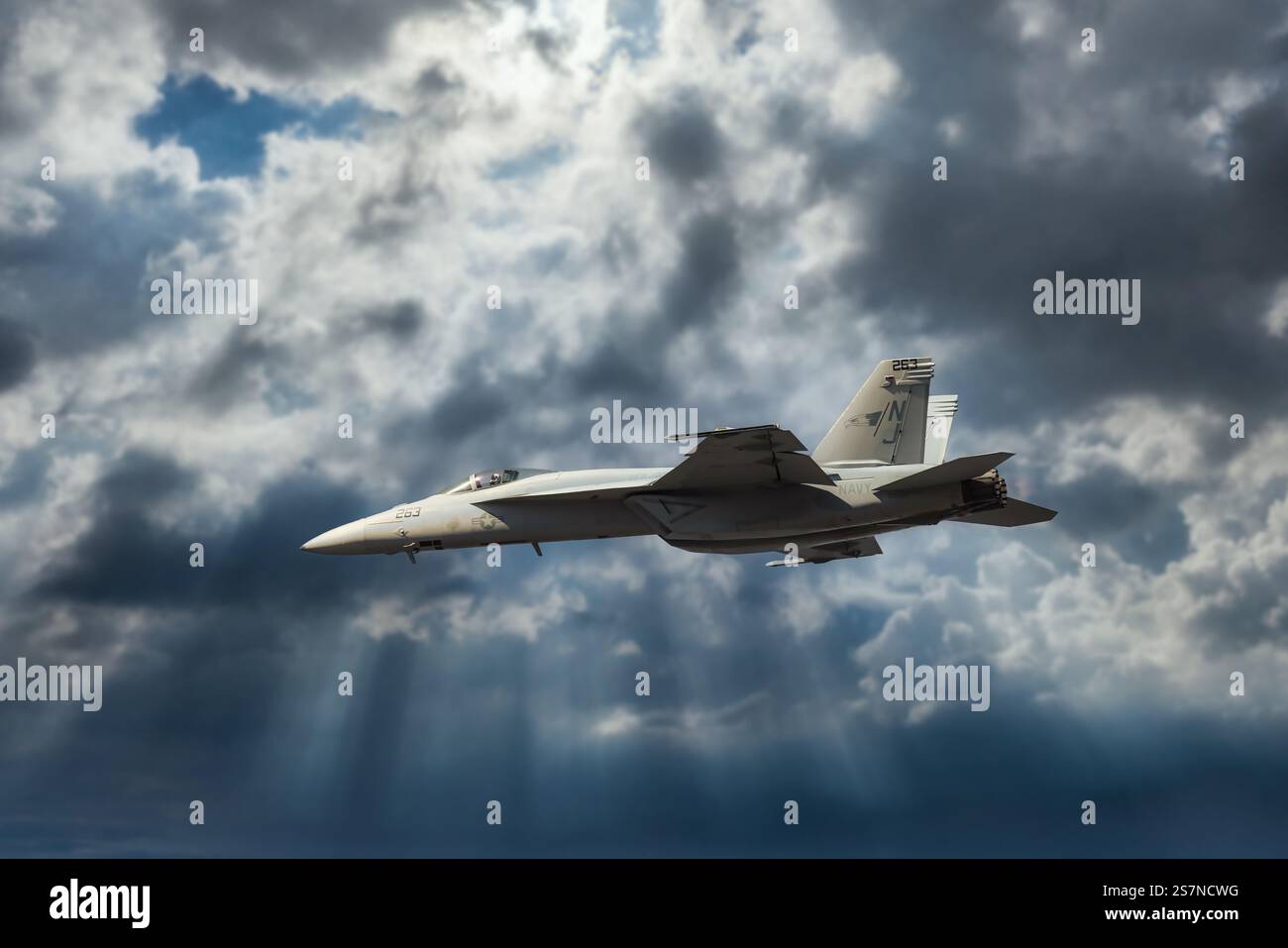 American Fighter Jet Flying Through Dramatic Clouds Stock Photo - Alamy