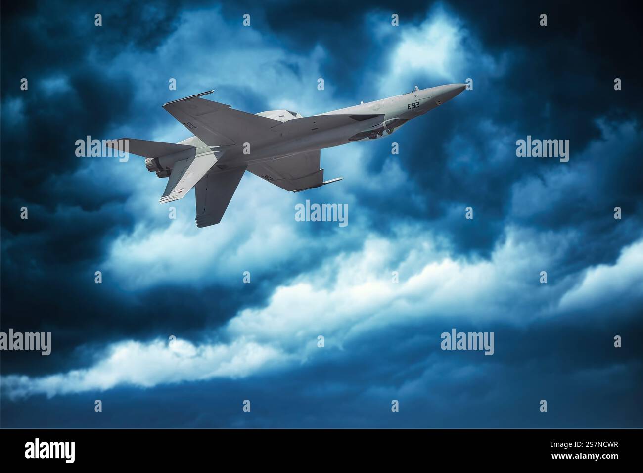 American Fighter Jet Flying Through Dramatic Clouds Stock Photo - Alamy