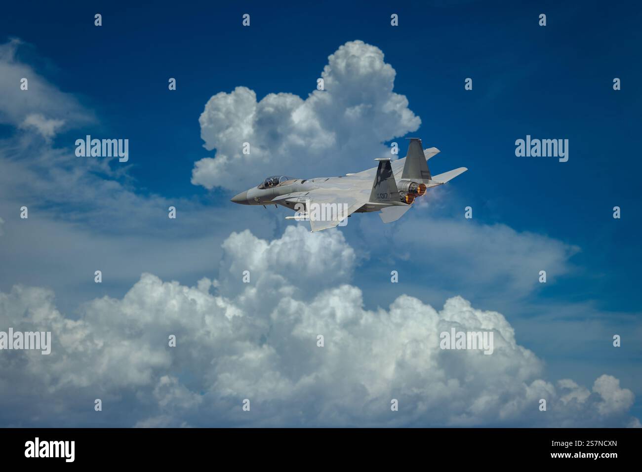 American Fighter Jet Flying Through Dramatic Clouds Stock Photo - Alamy