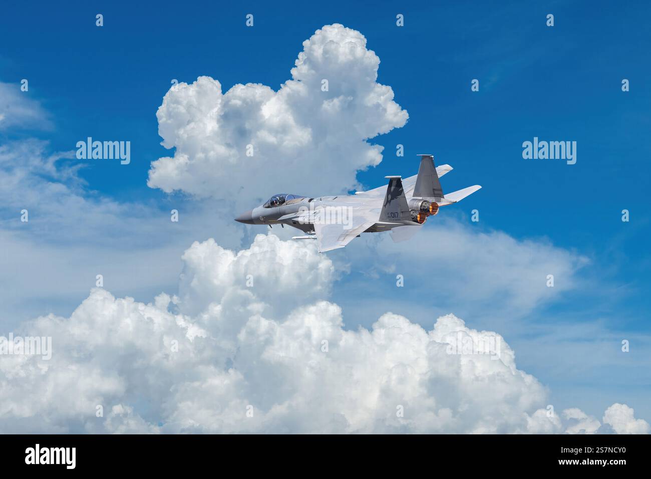 American Fighter Jet Flying Through Dramatic Clouds Stock Photo - Alamy