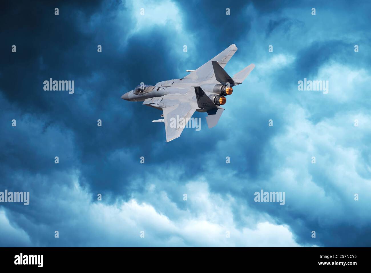 American Fighter Jet Flying Through Dramatic Clouds Stock Photo - Alamy