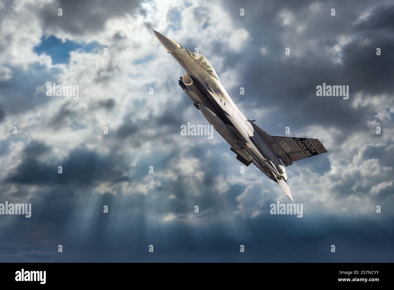 American Fighter Jet Flying Through Dramatic Clouds Stock Photo - Alamy