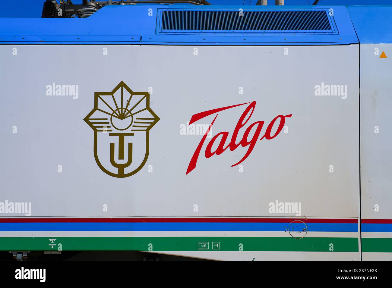 Logo of the Spanish train manufacturer Talgo on the electric locomotive ...