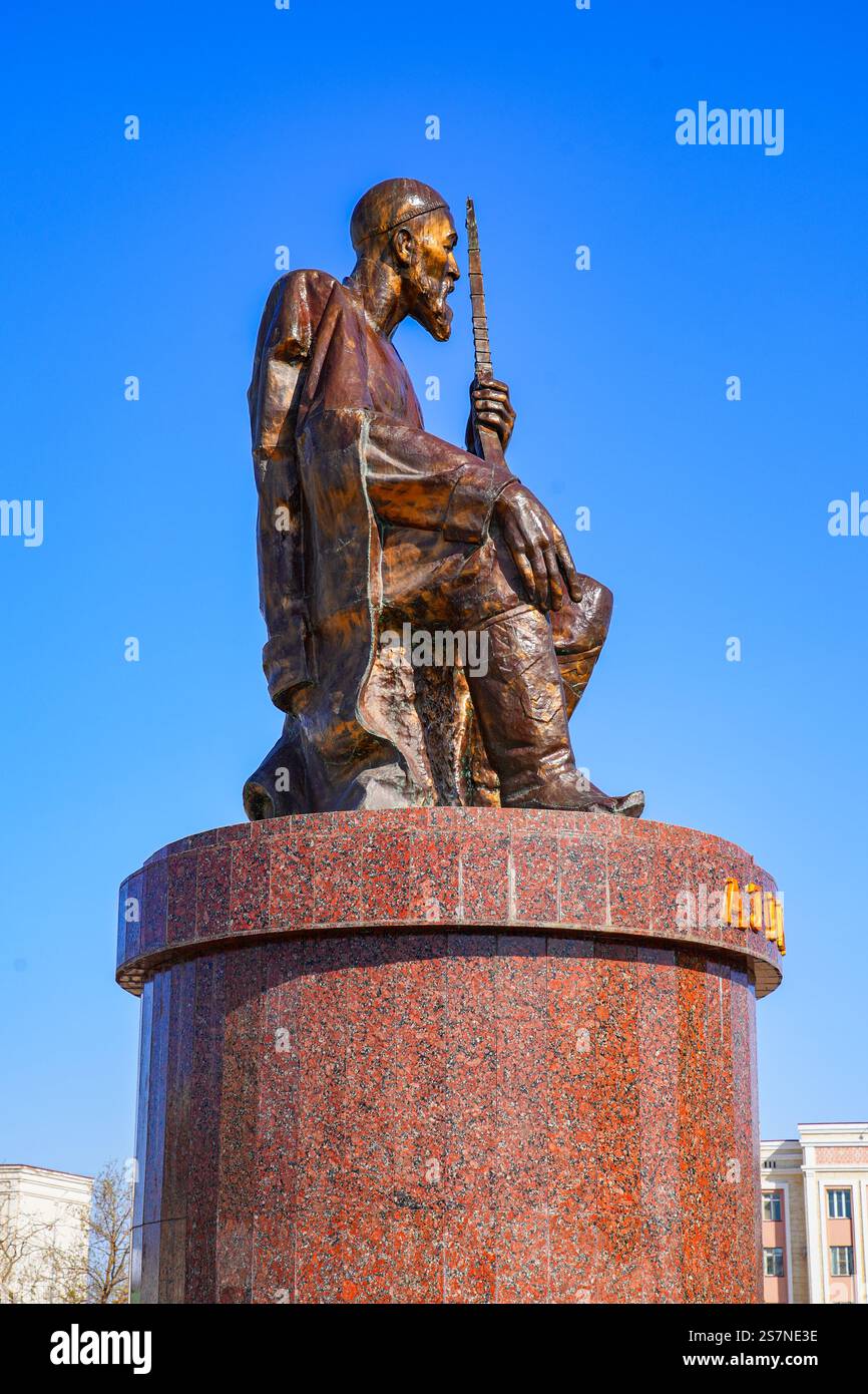 Statue of the Uzbek poet Ajiniyaz Kosibay Uli on the public square in ...
