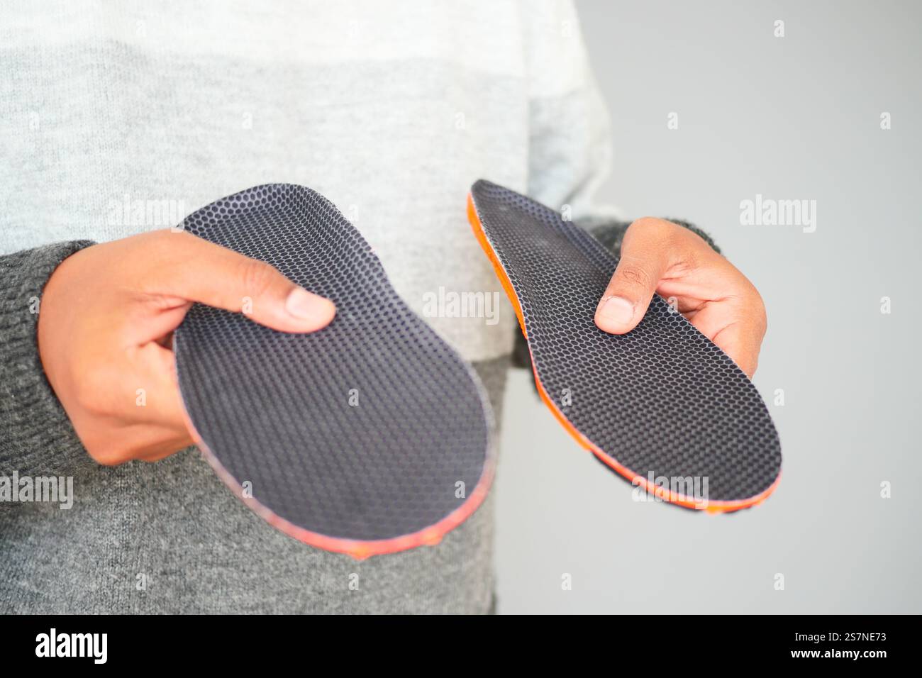 Visual comparison of two shoe insoles showcasing design and texture ...