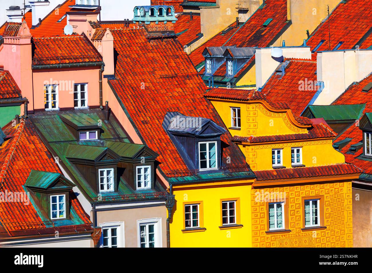 Colorful closely packed buildings with tiled roofs, typical of European ...