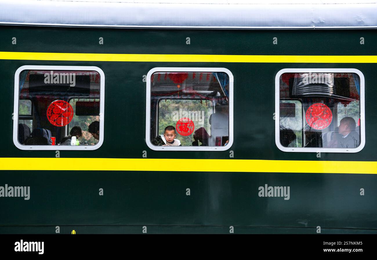 (250120) -- BEIJING, Jan. 20, 2025 (Xinhua) -- Villagers take the train ...