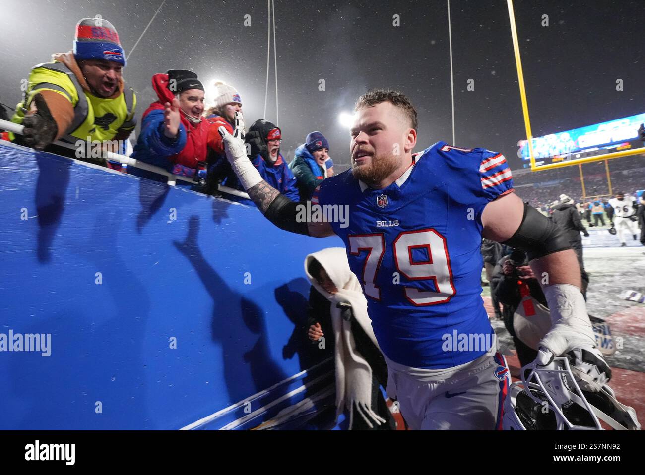 Buffalo Bills offensive tackle Spencer Brown (79) high fives fans after ...