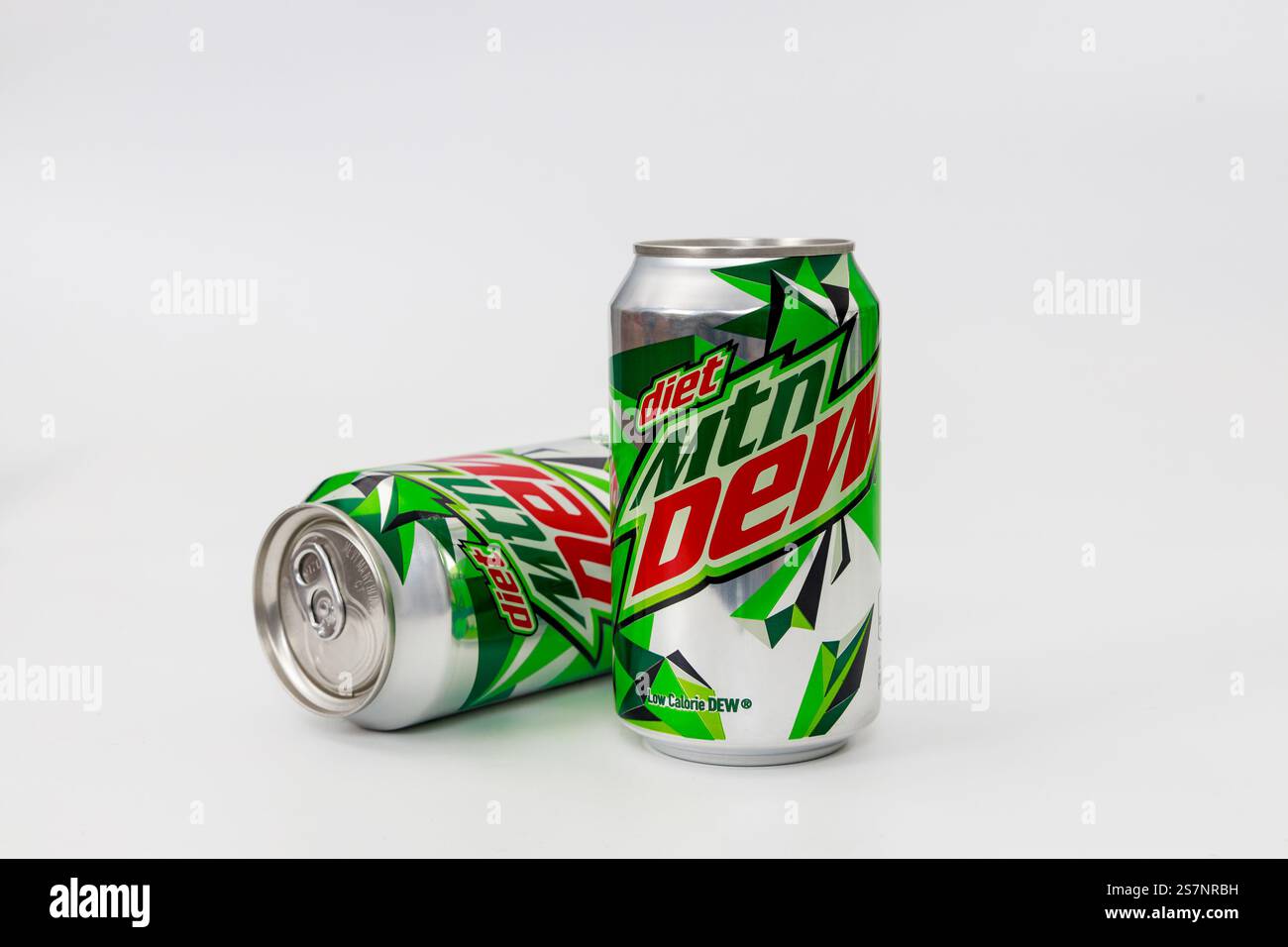 Refreshing cans of diet soft drink placed against simple background for ...