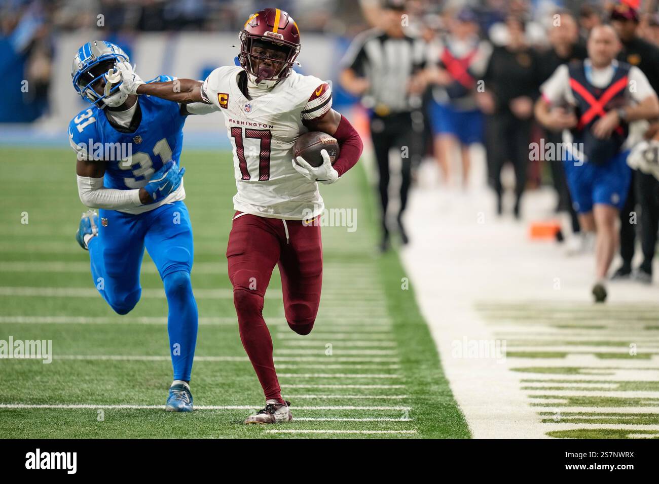 Washington Commanders wide receiver Terry McLaurin (17) stiff arms ...