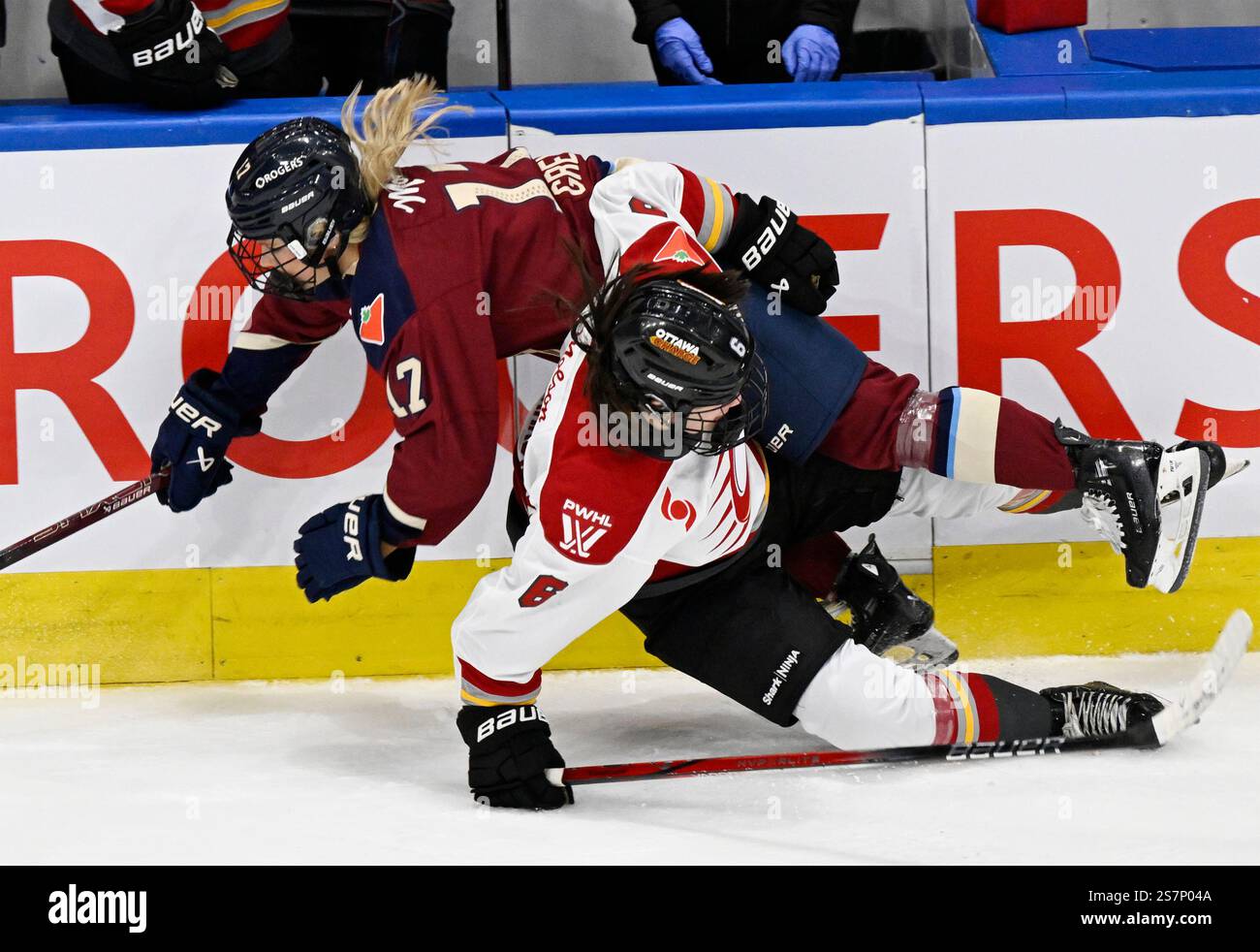 Montreal Victoire's Dara Greig (17) trips over Ottawa Charge's ...