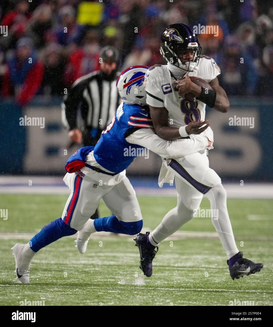 Buffalo Bills cornerback Taron Johnson (7) tackles Baltimore Ravens ...