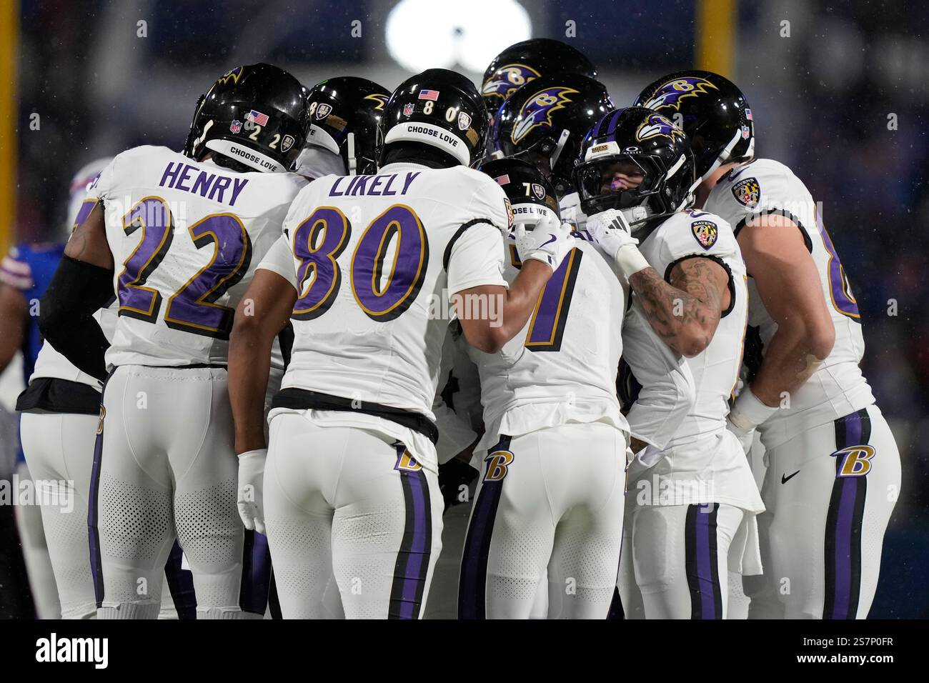 The Baltimore Ravens huddle during the first half of an NFL divisional ...