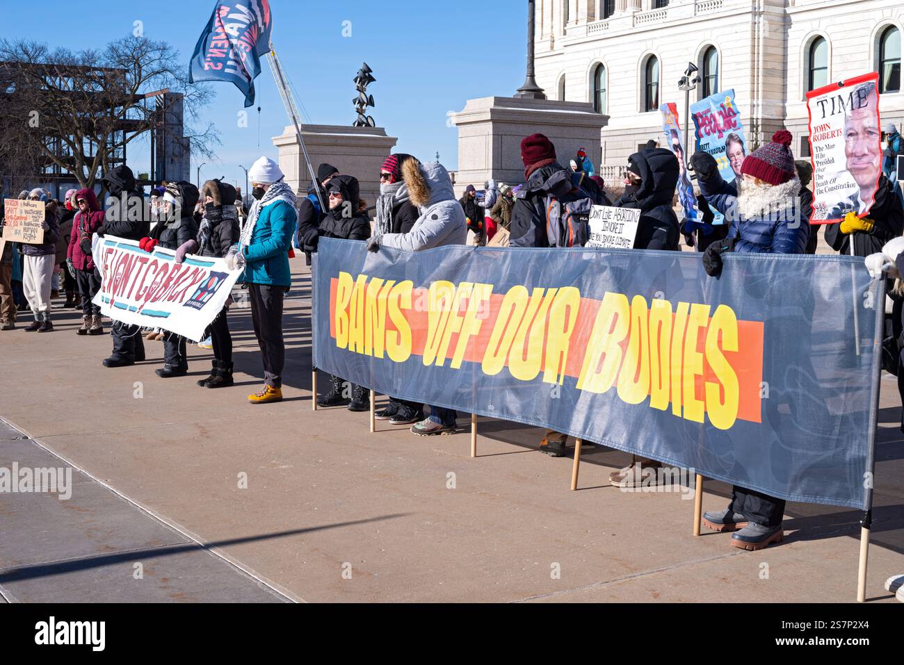 St. Paul, MN - January 18, 2025: Participants behind speakers’ podium ...