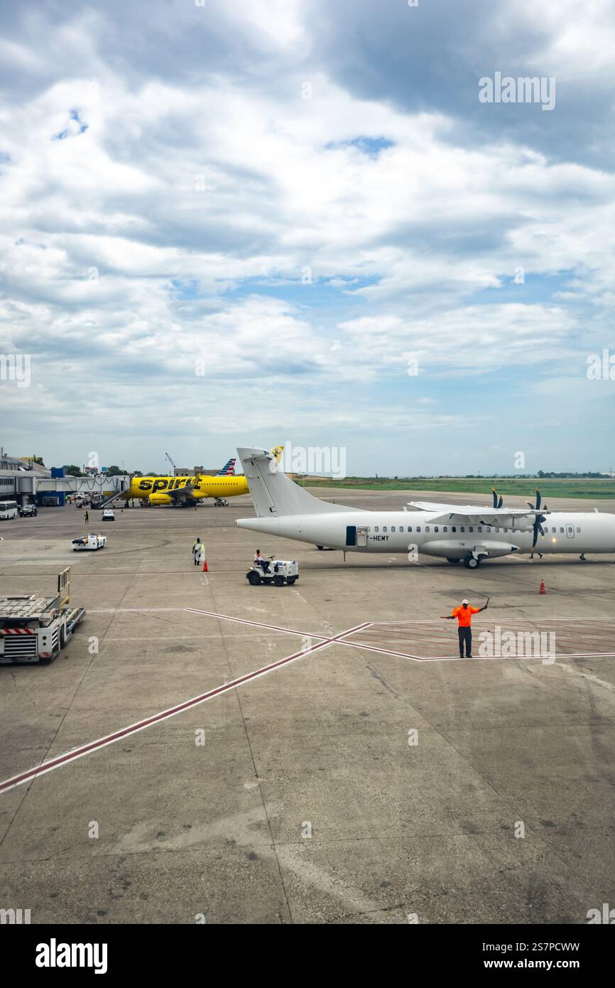 Bustling activity in the Port-au-Prince airport, with a Spirit Airline ...