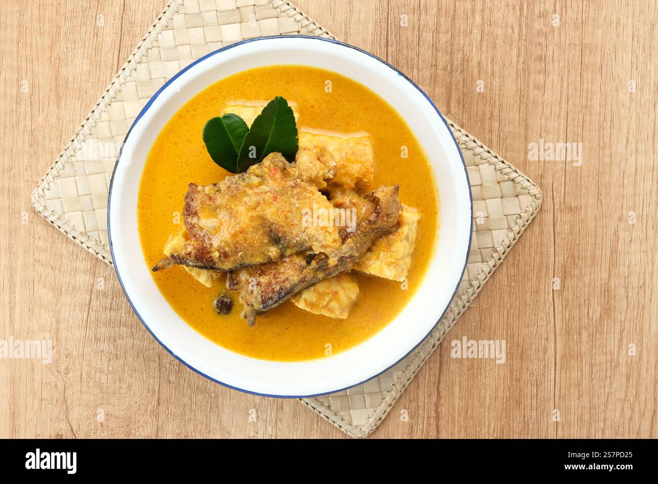 Mangut, made from smoked stingray fish cooked with spices and coconut ...