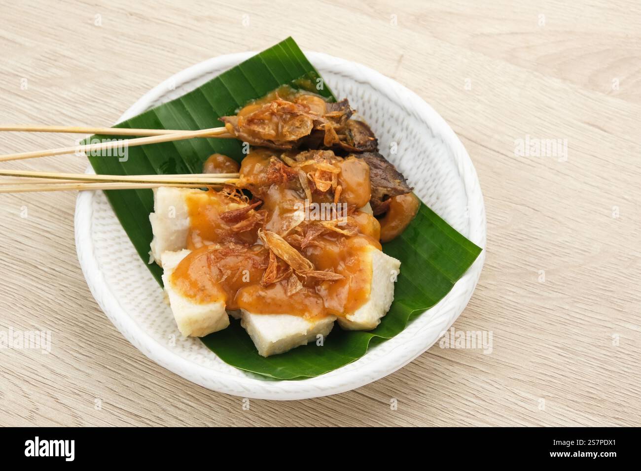 Sate Padang, beef satay from West Sumatra, Indonesia, served with spicy ...