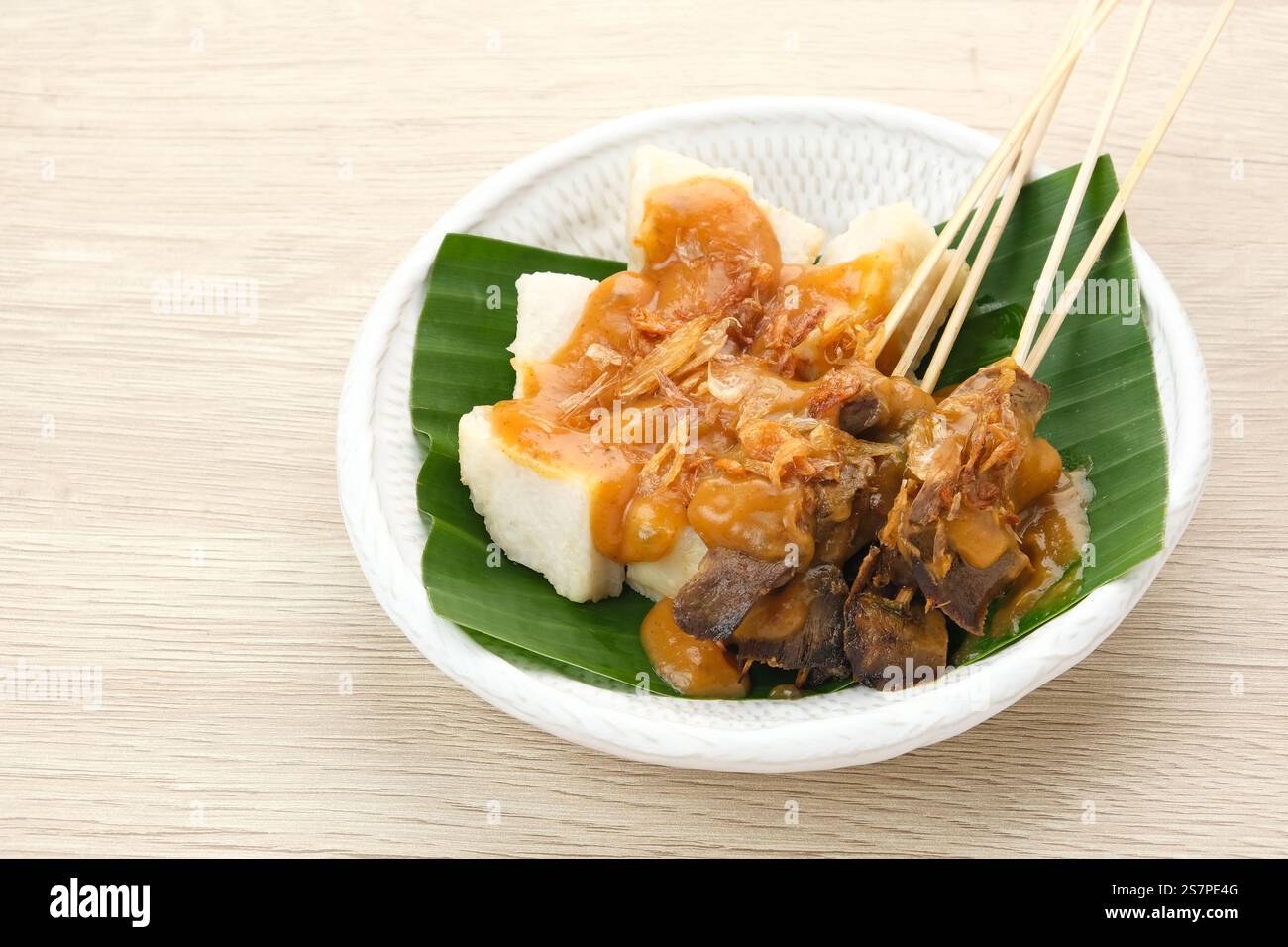 Sate Padang, beef satay from West Sumatra, Indonesia, served with spicy ...