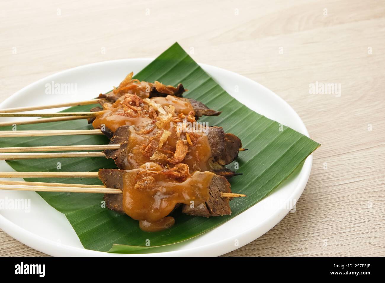 Sate Padang, beef satay from West Sumatra, Indonesia, served with spicy ...