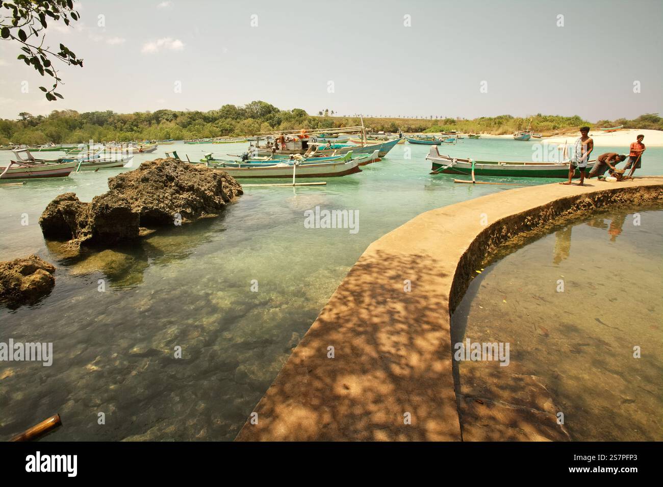 Fishing boats and a concrete pathway on Pero beach in Pero Batang ...