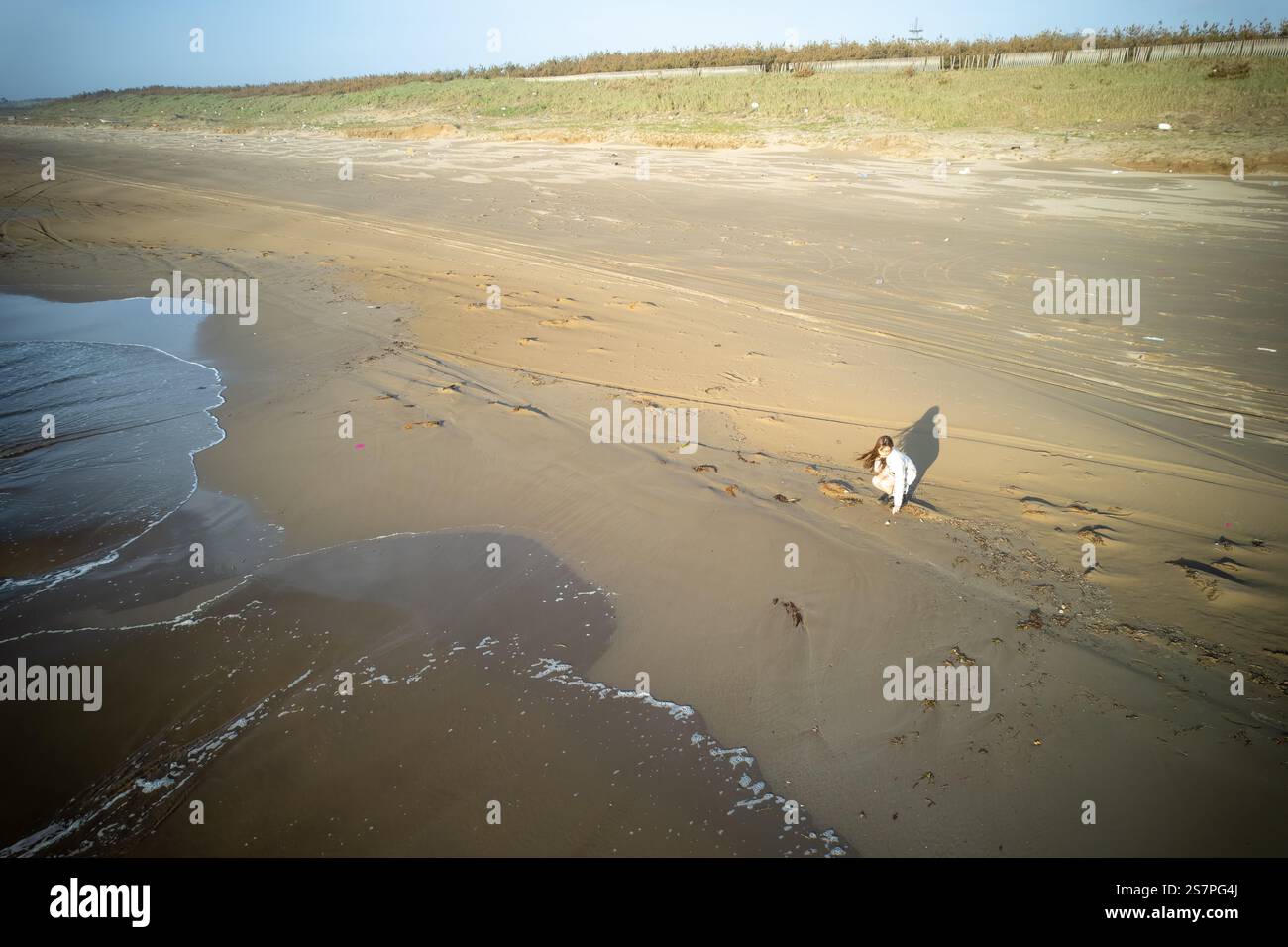 Aerial photo of a Japanese woman wearing white clothes watching the ...