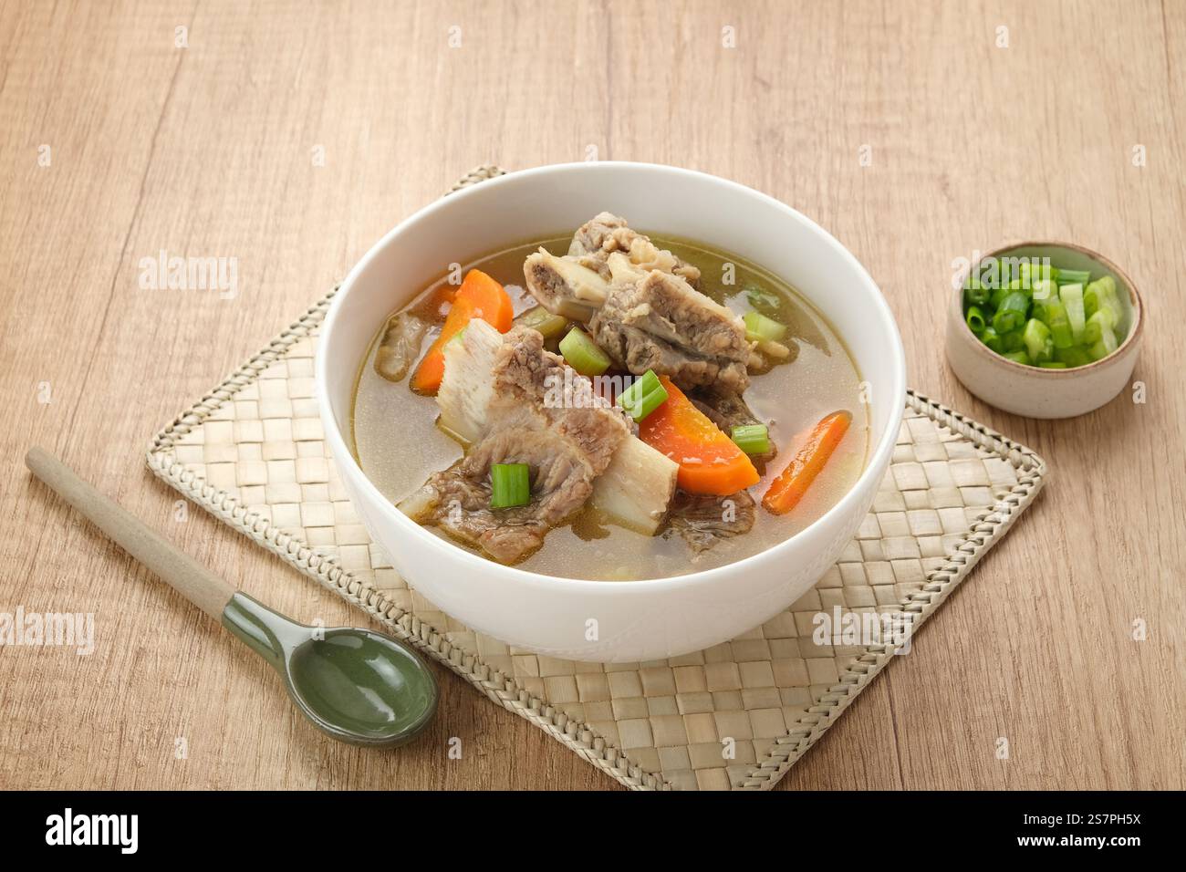 Sop Iga (Beef ribs soup) made from ribs, carrots, leeks. Served in ...