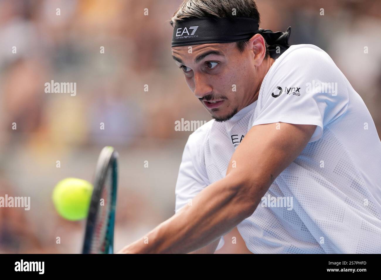 Lorenzo Sonego of Italy plays a backhand return to Learner Tien of the ...
