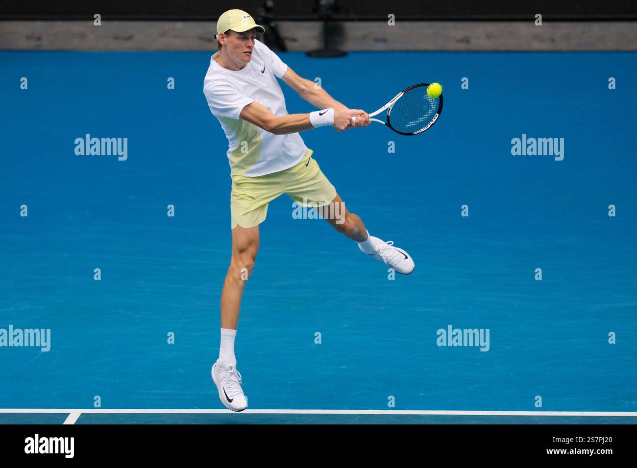 Jannik Sinner of Italy plays a backhand return to Holger Rune of Denmark during their fourth ...