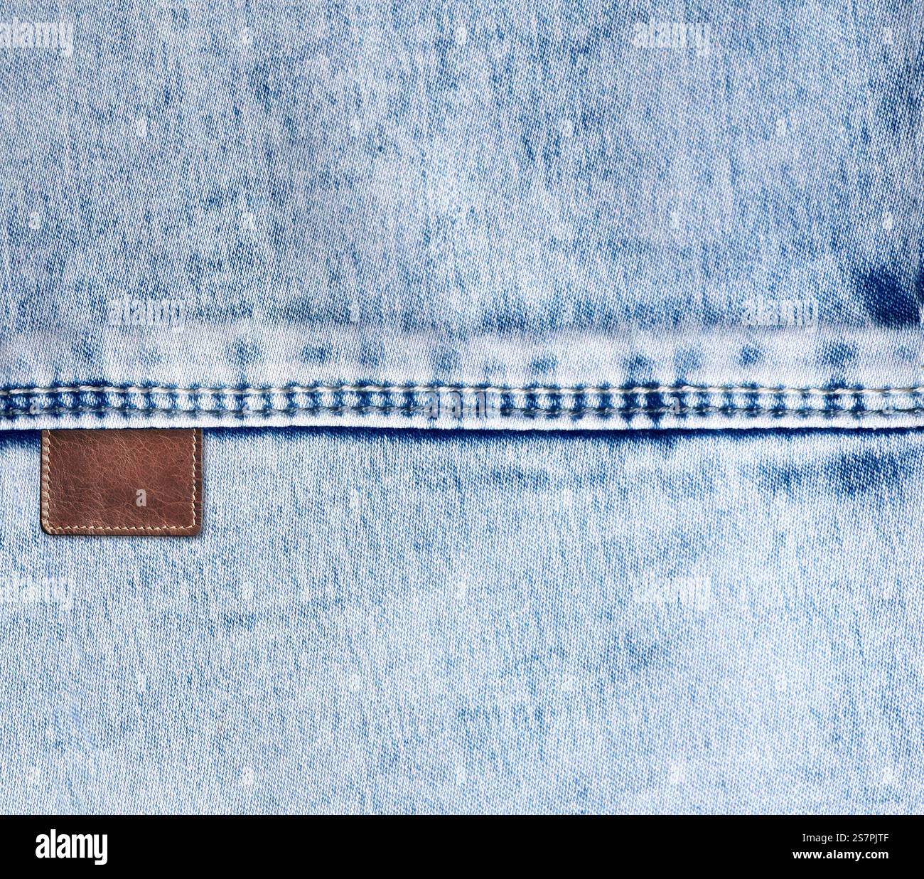 Vertical background with light blue denim texture with a seam and old ...